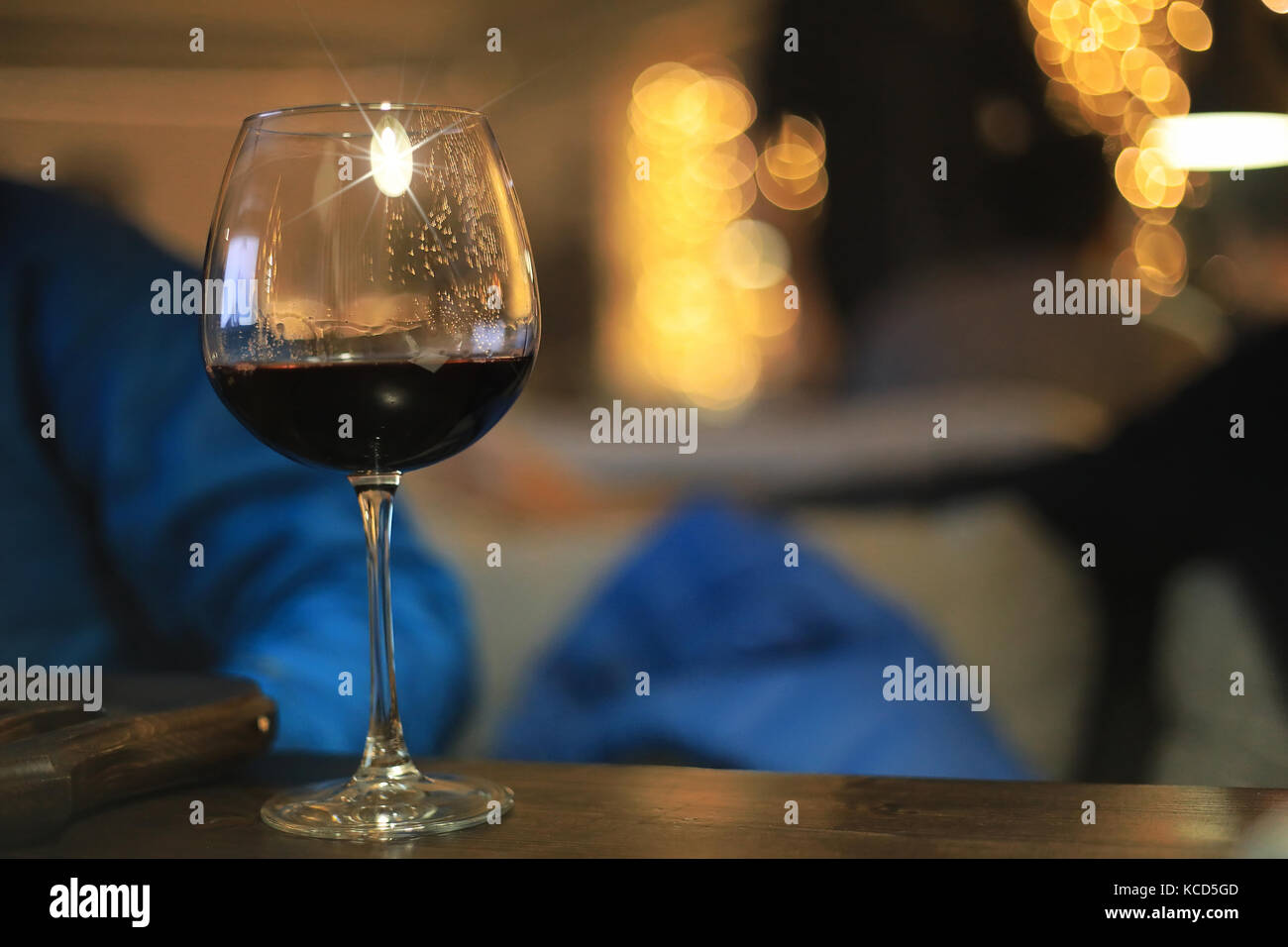 glass of cold alcohol drink with ice on table Stock Photo - Alamy