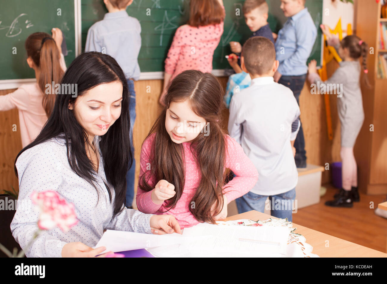 Teacher with pupils during a break Stock Photo - Alamy