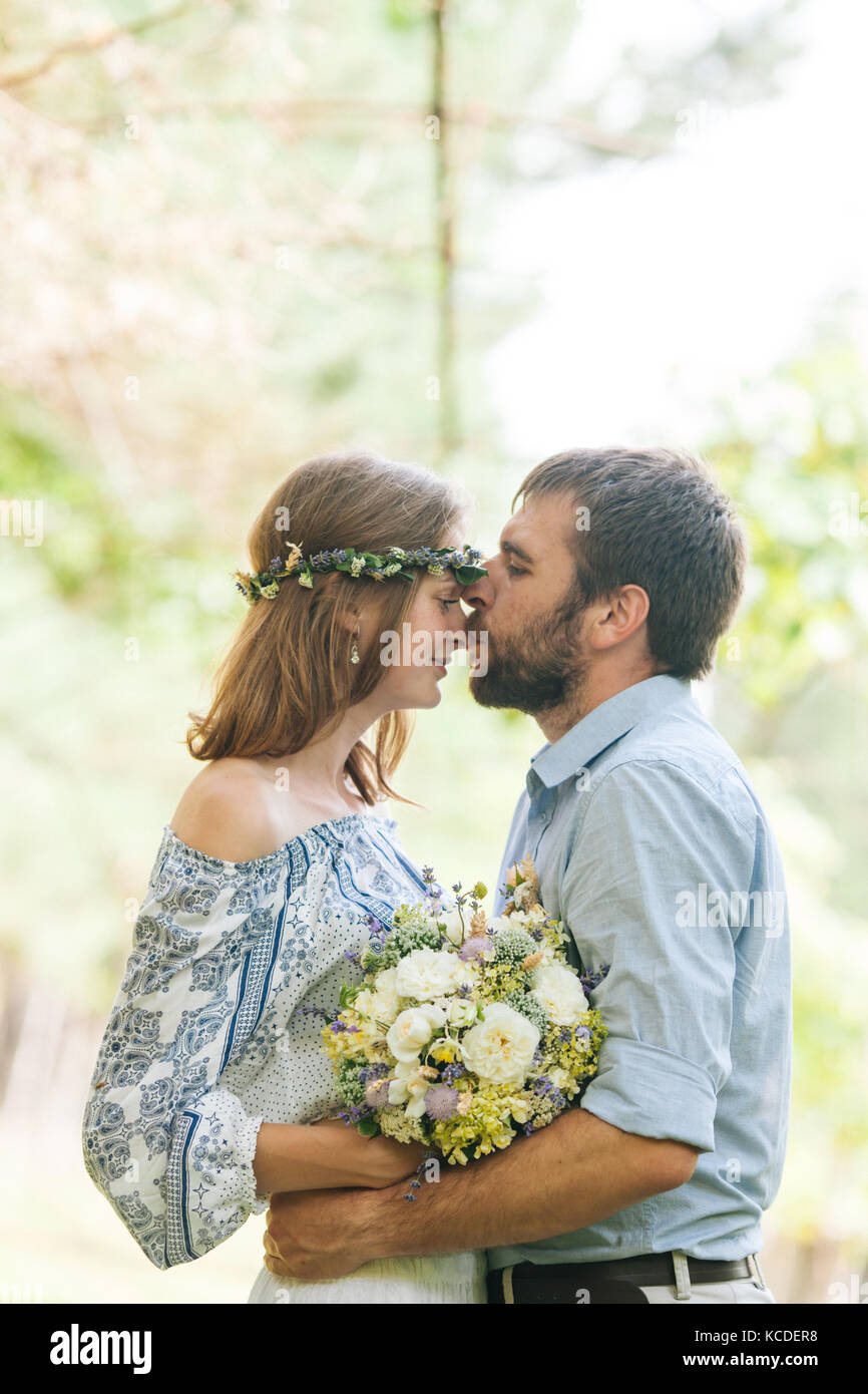Eclectic rustic wedding couple Stock Photo - Alamy