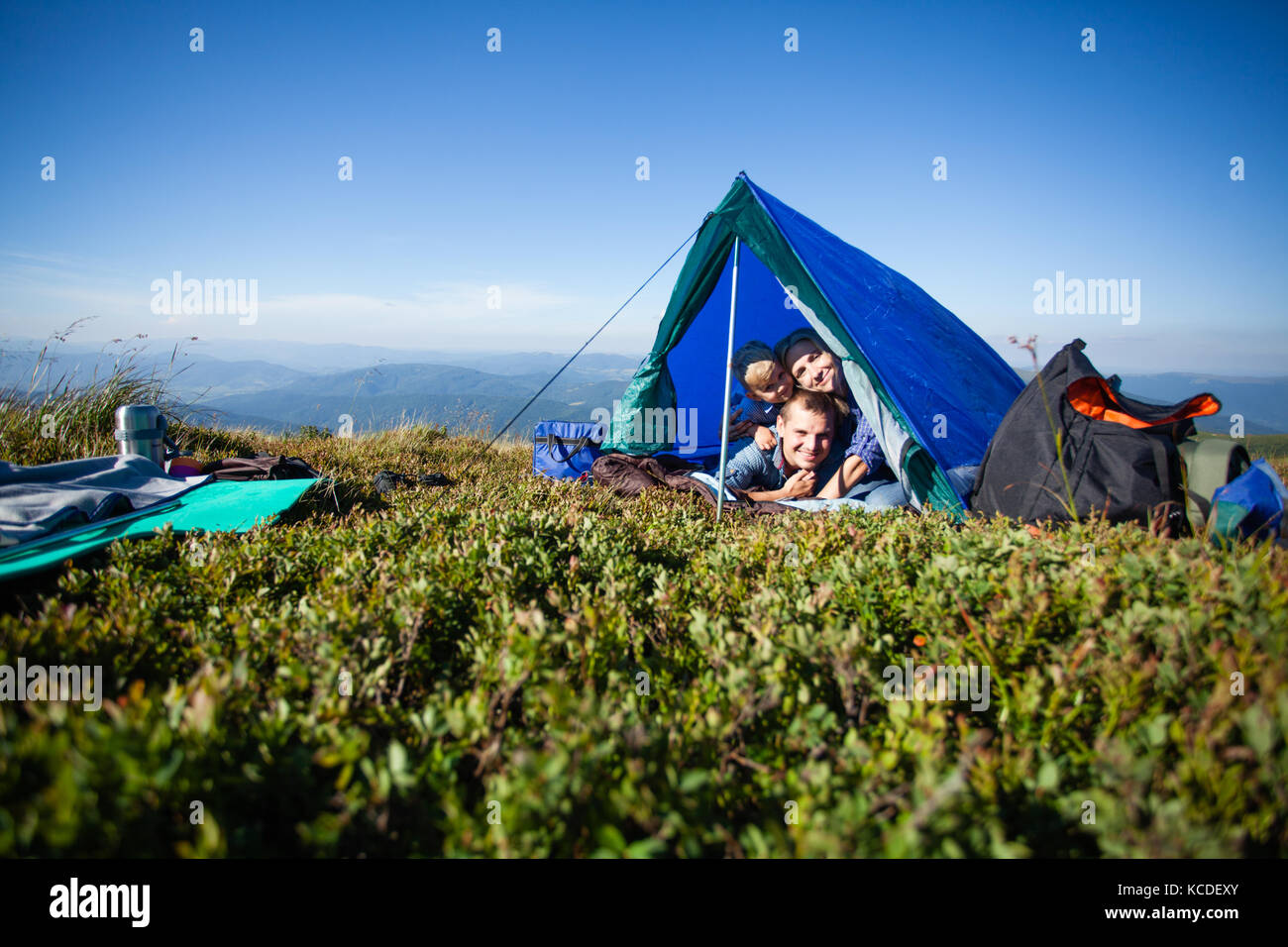 The family looks out of the tent Stock Photo - Alamy
