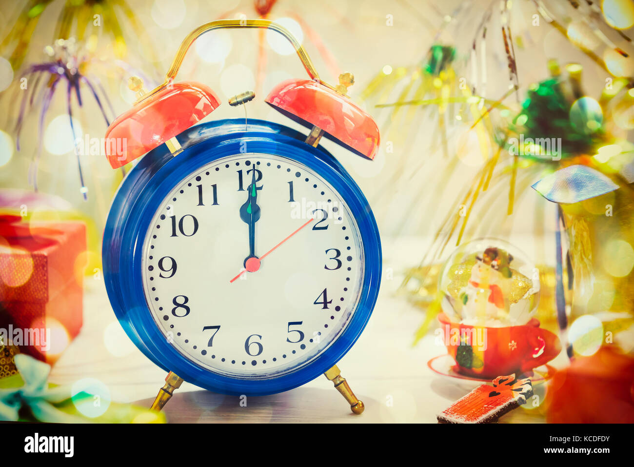 Close up bright clock with midnight time, christmas decorations and ...