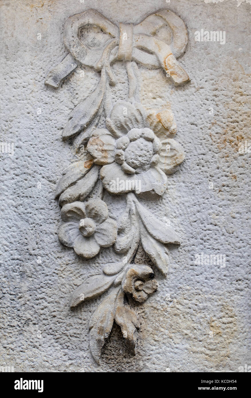 Ornaments, mouldings, gargoyle, low reliefs in a sandstone, granite ...