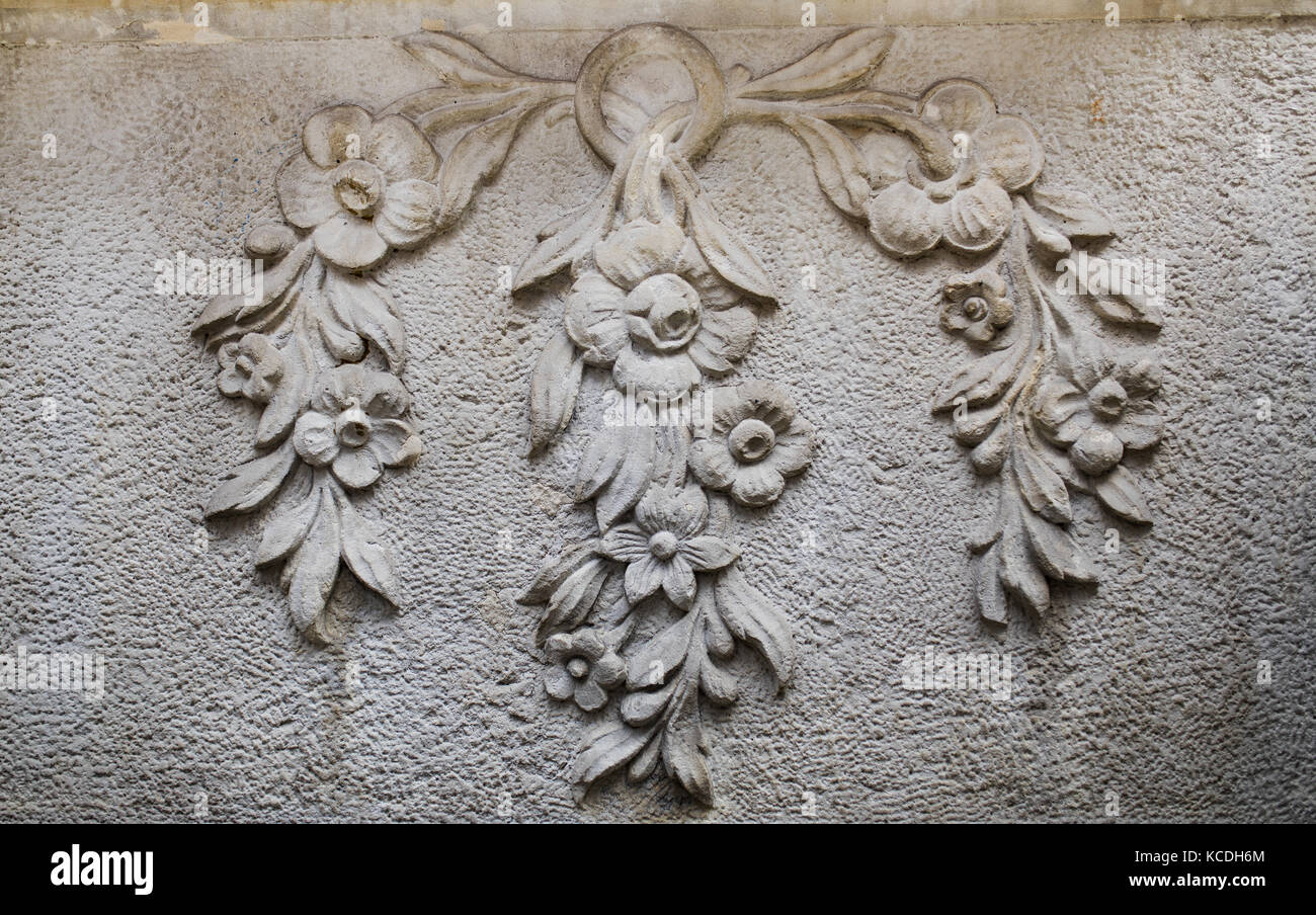 Ornaments, mouldings, gargoyle, low reliefs in a sandstone, granite ...