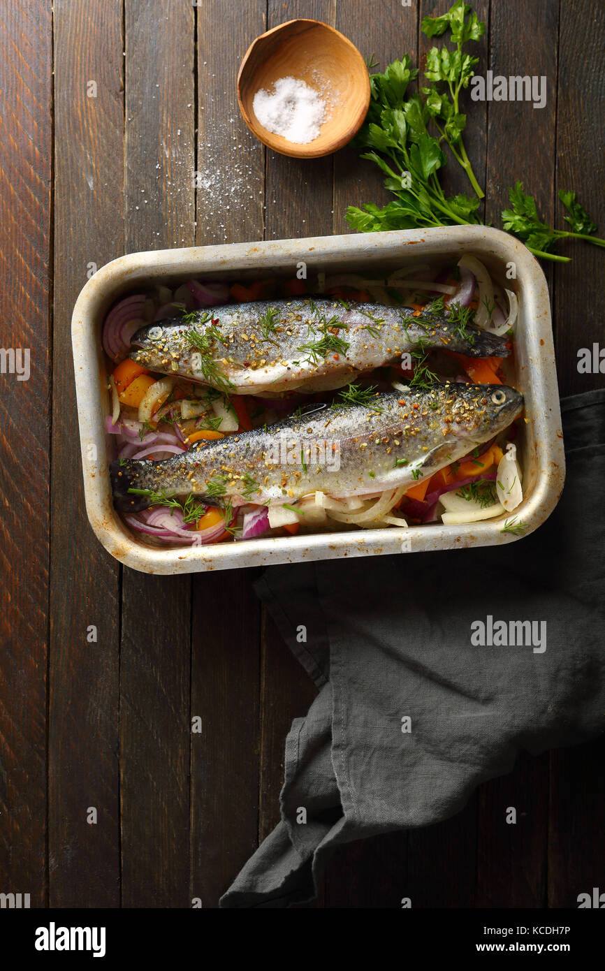 Fishes in baking dish, cooking food Stock Photo - Alamy