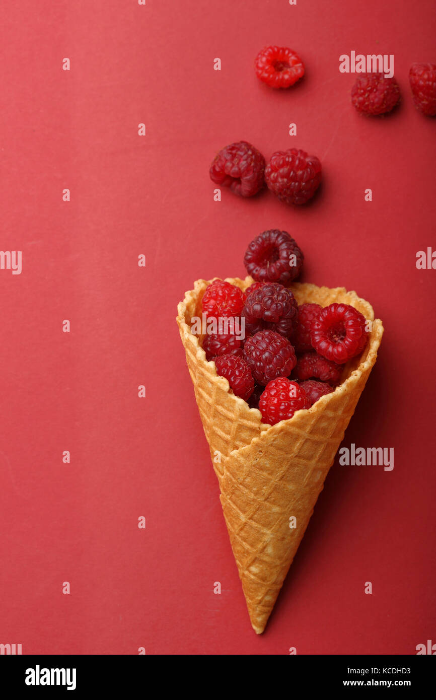 Raspberries in cone, food concept Stock Photo - Alamy