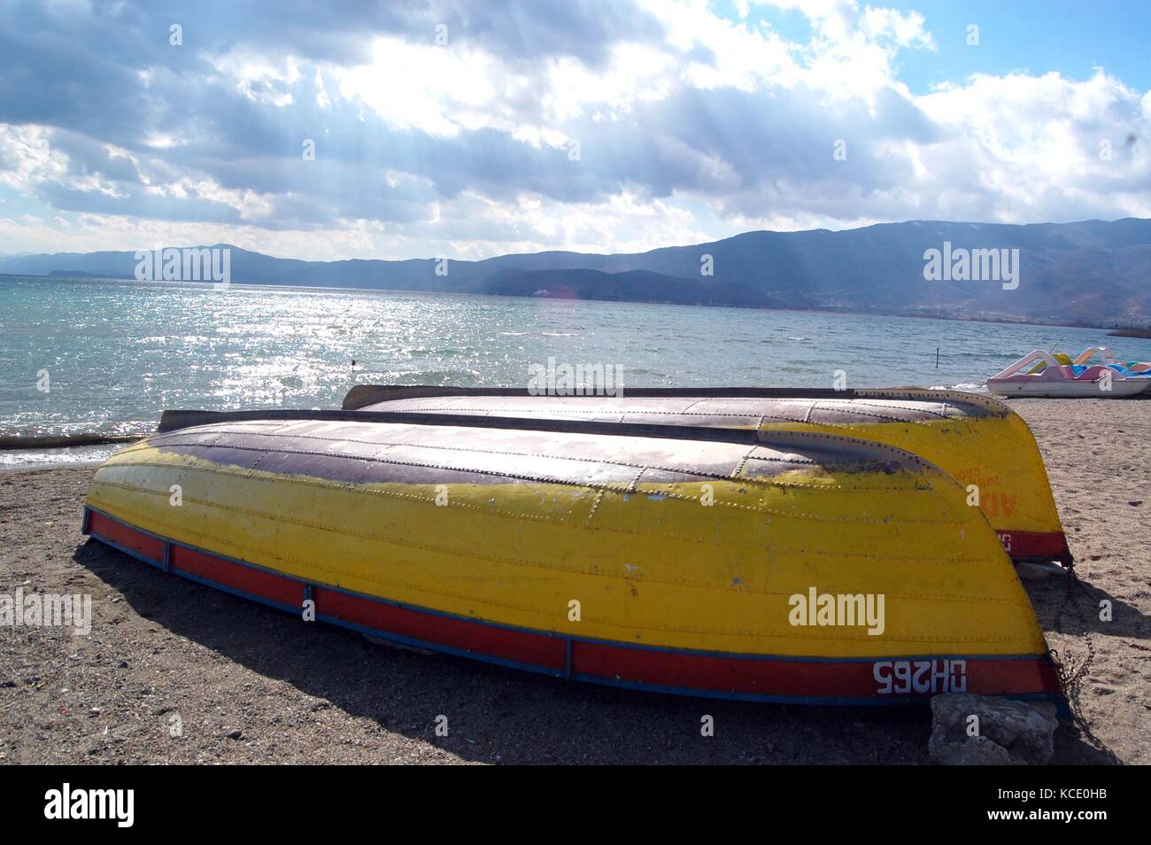 Boat on a beach od Lake Ohrid, Macedonia, view from Struga city ...