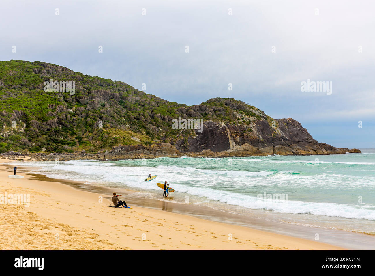 Surfers on Boomerang beach in Pacific Palms on the mid north coast of ...