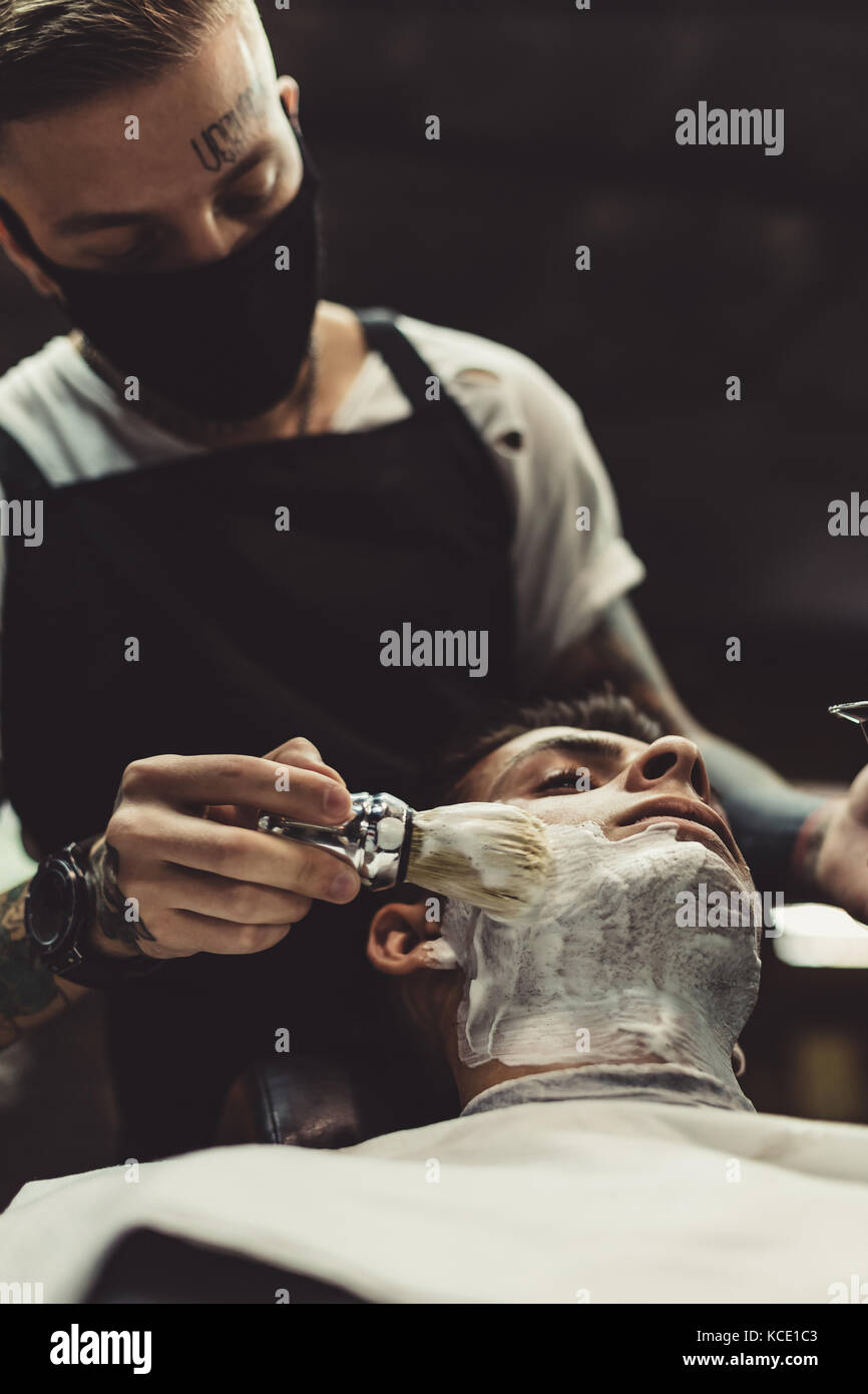 Barber shaving client Stock Photo - Alamy Barber shaving client Stock Photo - Alamy