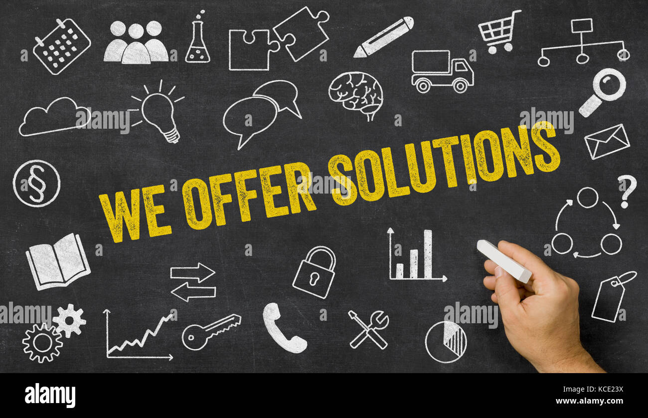 We offer solutions written on a blackboard with icons Stock Photo - Alamy