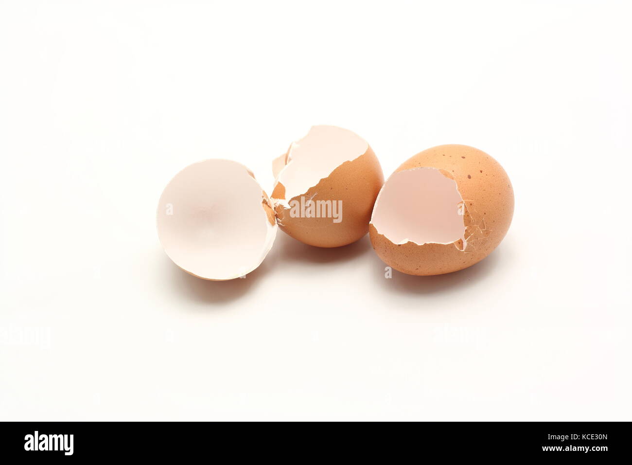 Pile of broken eggshell on white background Stock Photo - Alamy