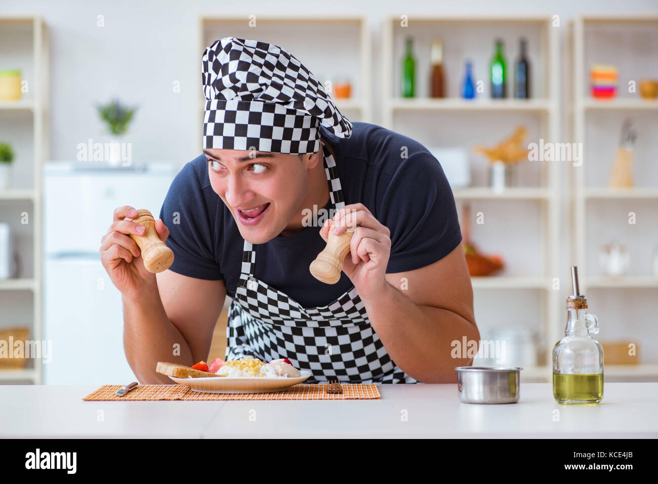 Chef cook cooking a meal breakfast dinner in the kitchen Stock Photo ...