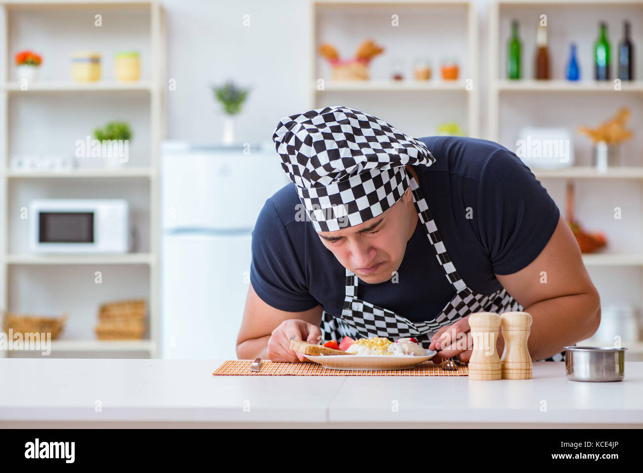 Chef cook cooking a meal breakfast dinner in the kitchen Stock Photo ...