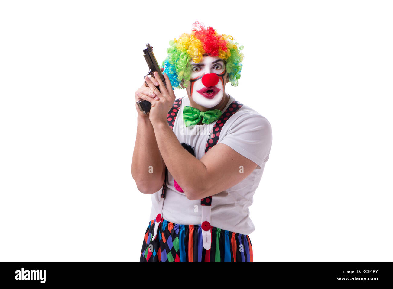 Funny clown with a gun pistol isolated on white background Stock Photo ...
