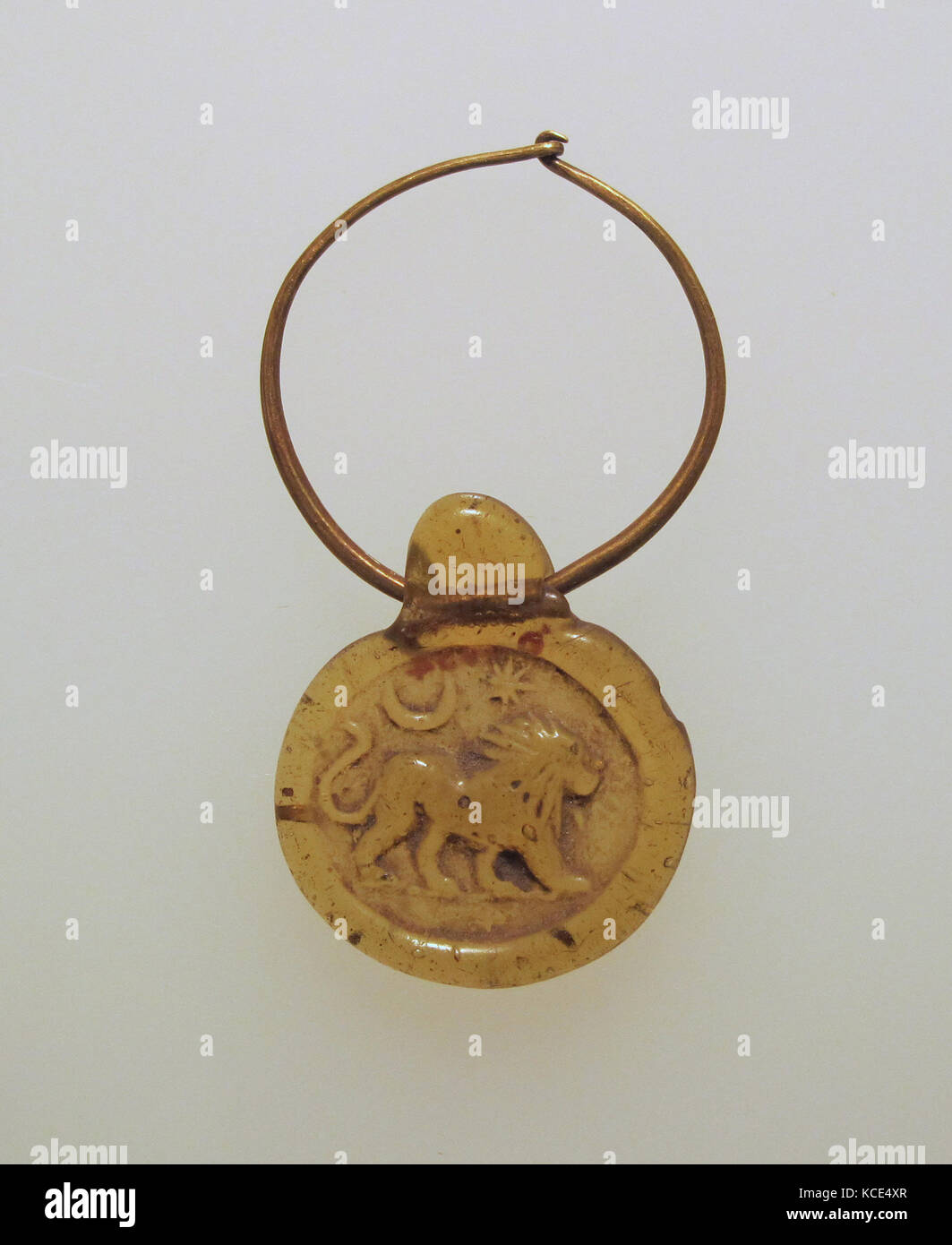 Glass stamped disk pendant hi-res stock photography and images - Alamy