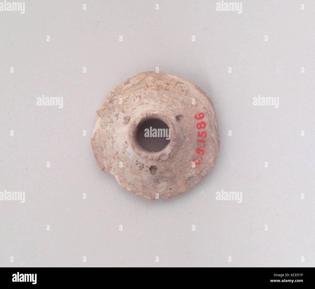 Spindle whorl, Bone, Diameter: 1 1/8 x 3/8 in. (2.9 x 1 cm Stock Photo ...