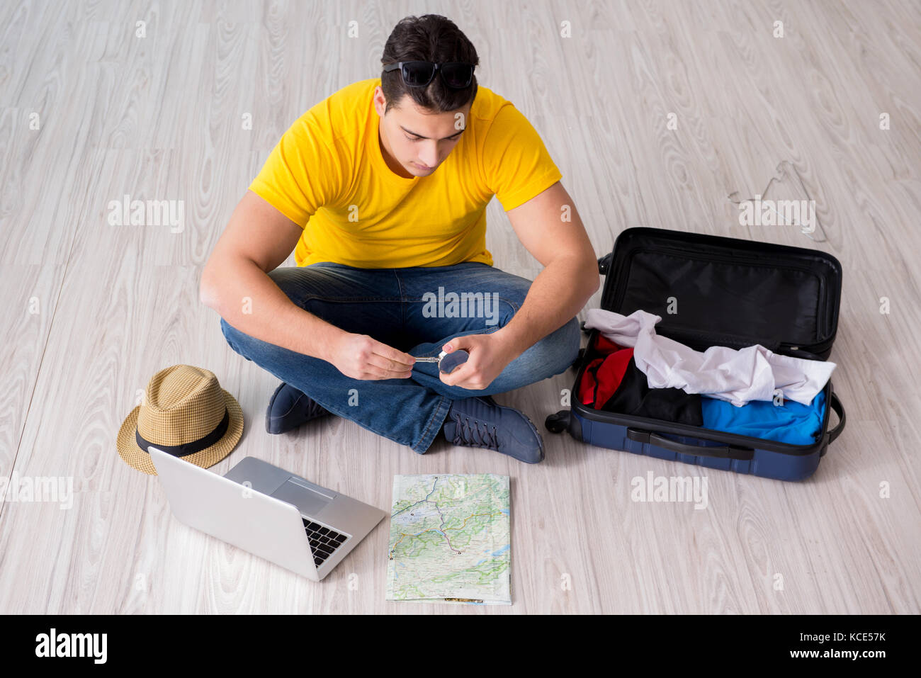Man planning his vacation trip with map Stock Photo - Alamy