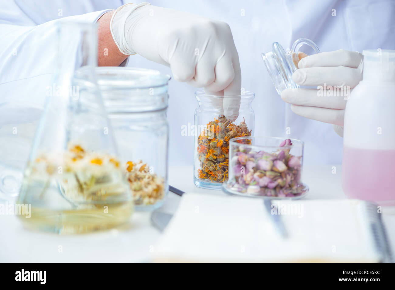 Chemist mixing perfumes in the lab Stock Photo - Alamy