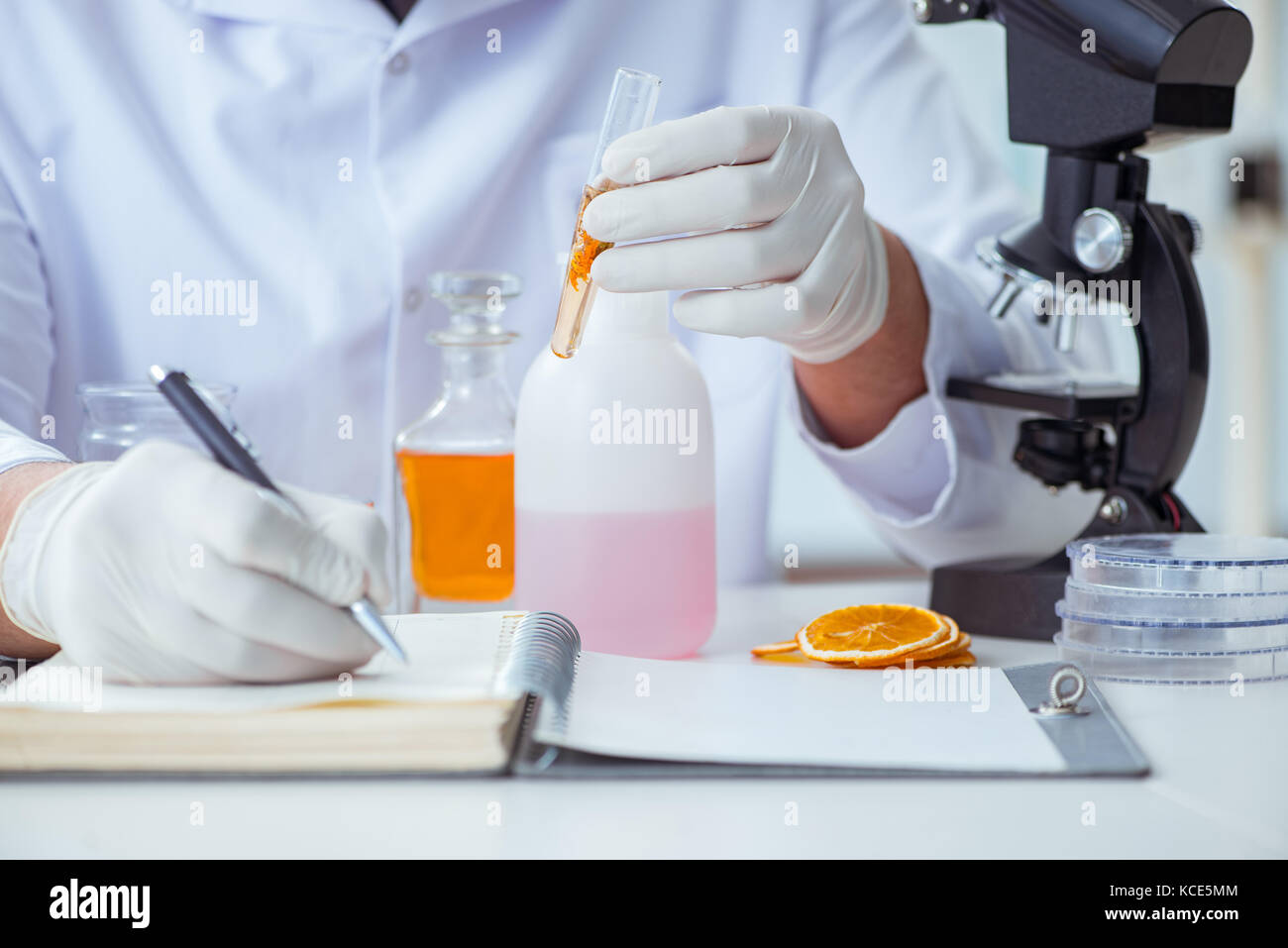 Chemist mixing perfumes in the lab Stock Photo - Alamy