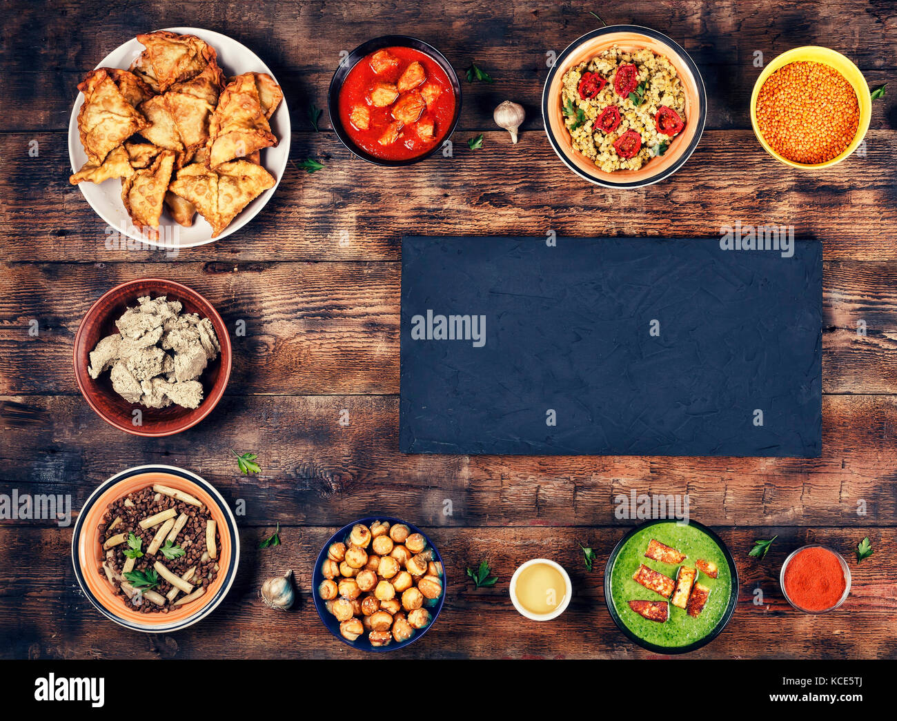 Assorted indian food on wooden background. Dishes and appetizers of ...