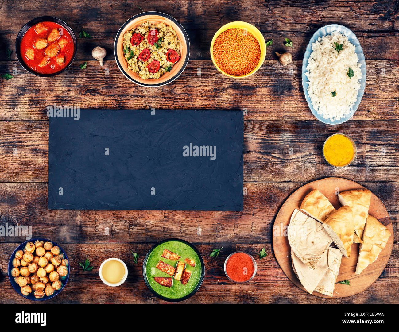 Assorted indian food on wooden background. Dishes and appetizers of ...