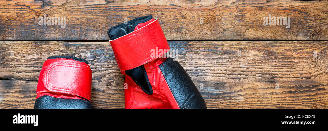 Boxing gloves on a wooden background. Closeup Stock Photo - Alamy
