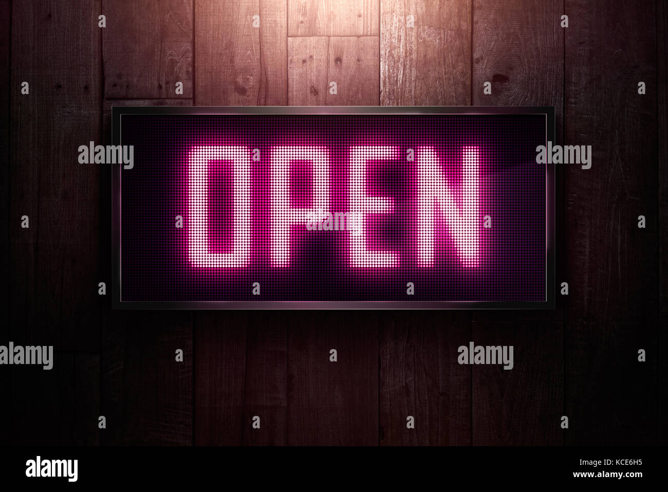 Open Led signage on wooden wall Stock Photo - Alamy