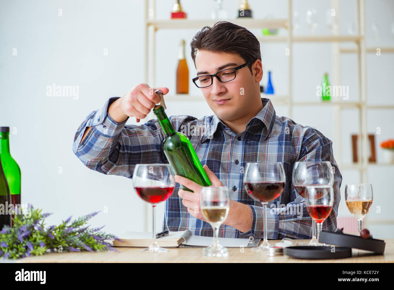 Professional sommelier tasting red wine Stock Photo - Alamy