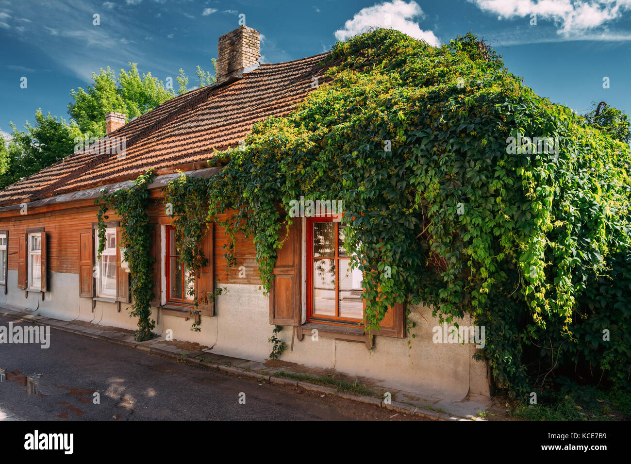 Vilnius, Lithuania. House Enlaced With Ivy In Uzupis Located In Old ...
