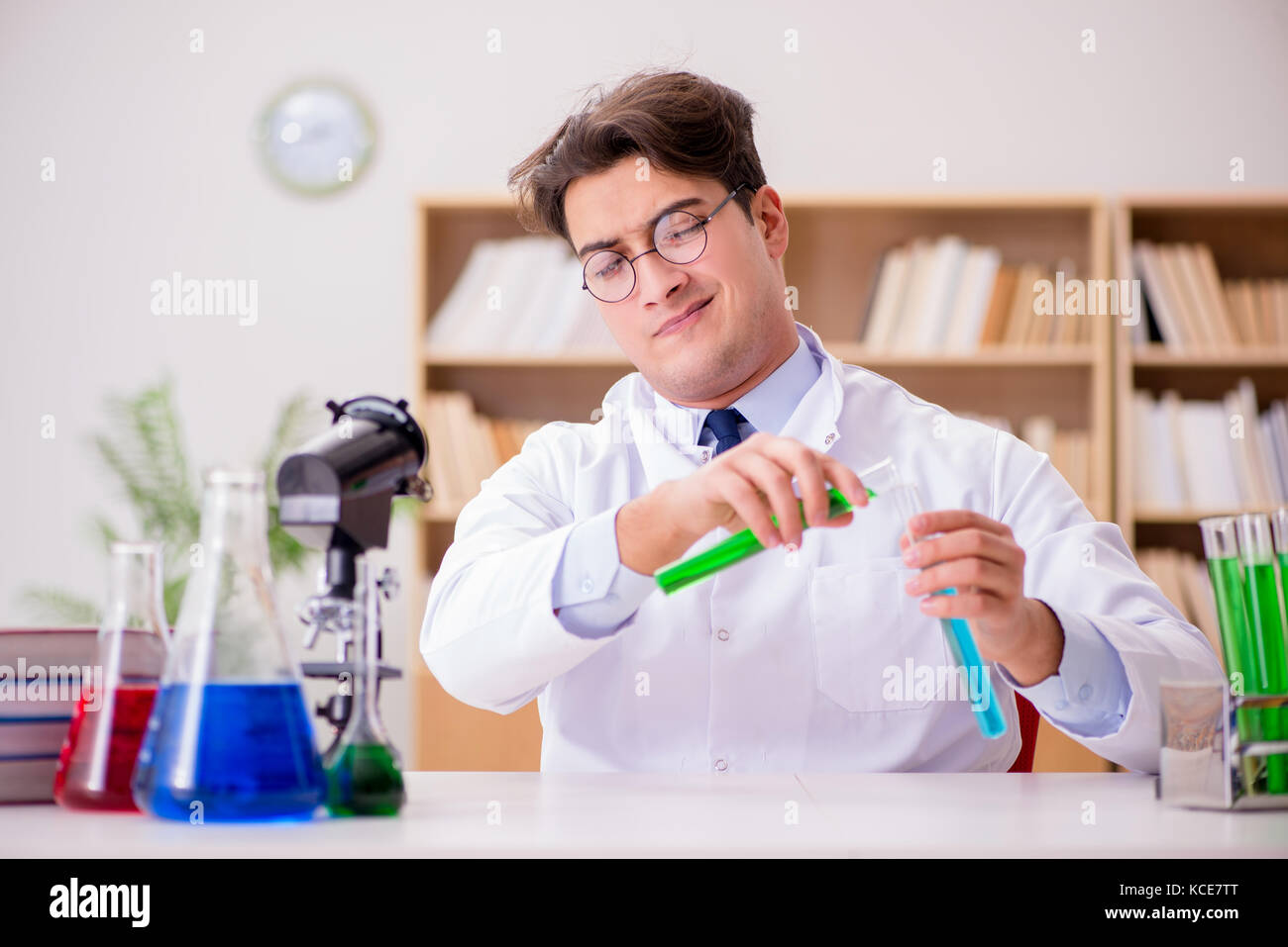 Mad crazy scientist doctor doing experiments in a laboratory Stock ...
