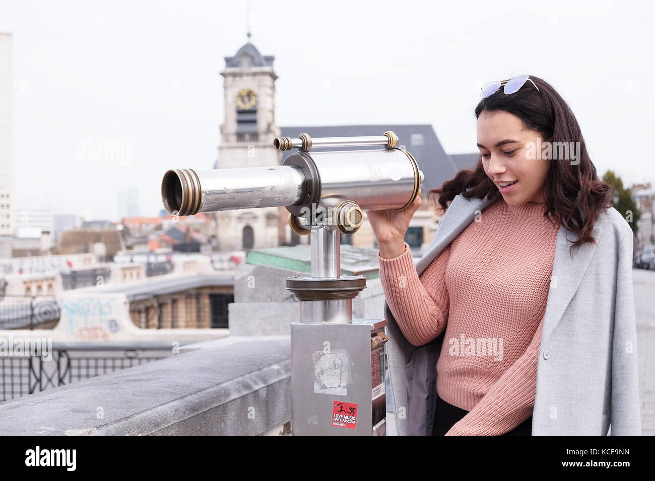 Fashionable young lady & telescope in Brussels Belgium Stock Photo - Alamy
