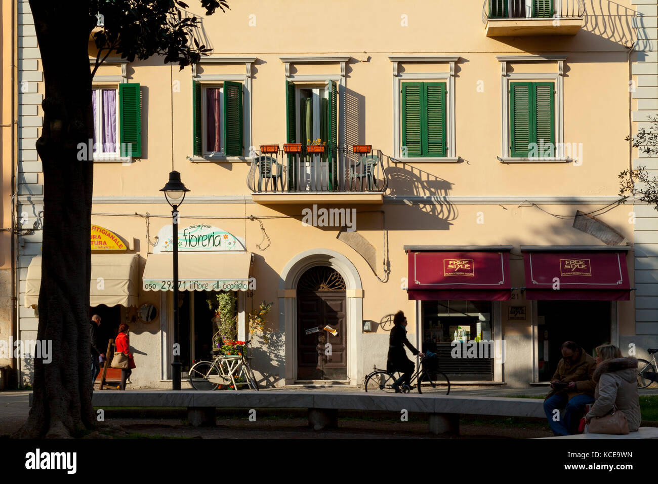 Streetscape in the medieval city of Pisa Tuscany, houses and shops ...