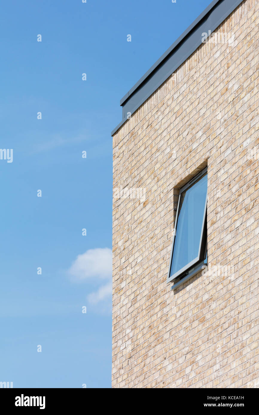 Modern open top hung window in pale brick facade Stock Photo - Alamy