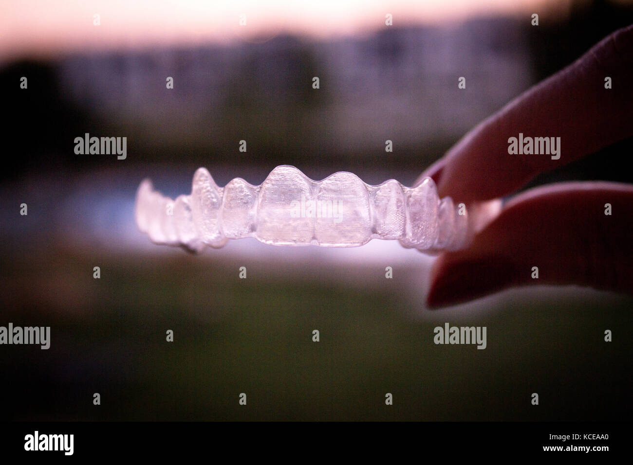 Invisible orthodontics for aligning teeth Stock Photo - Alamy