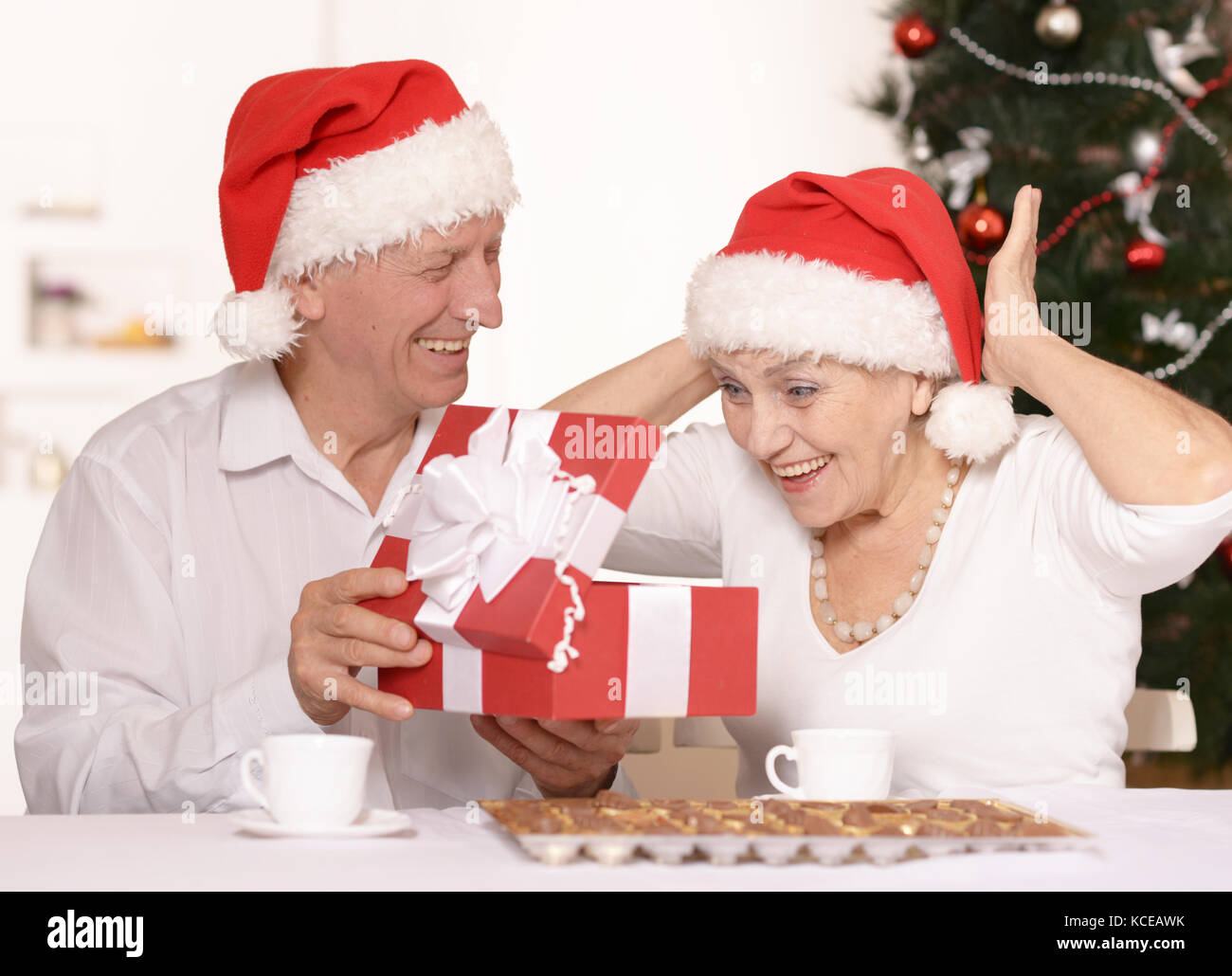 Man giving present to woman Stock Photo - Alamy