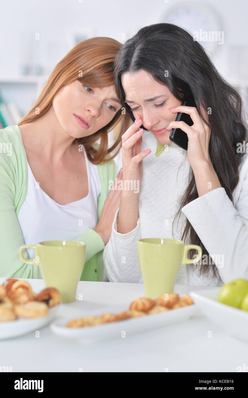 crying girl talking on smartphone Stock Photo - Alamy