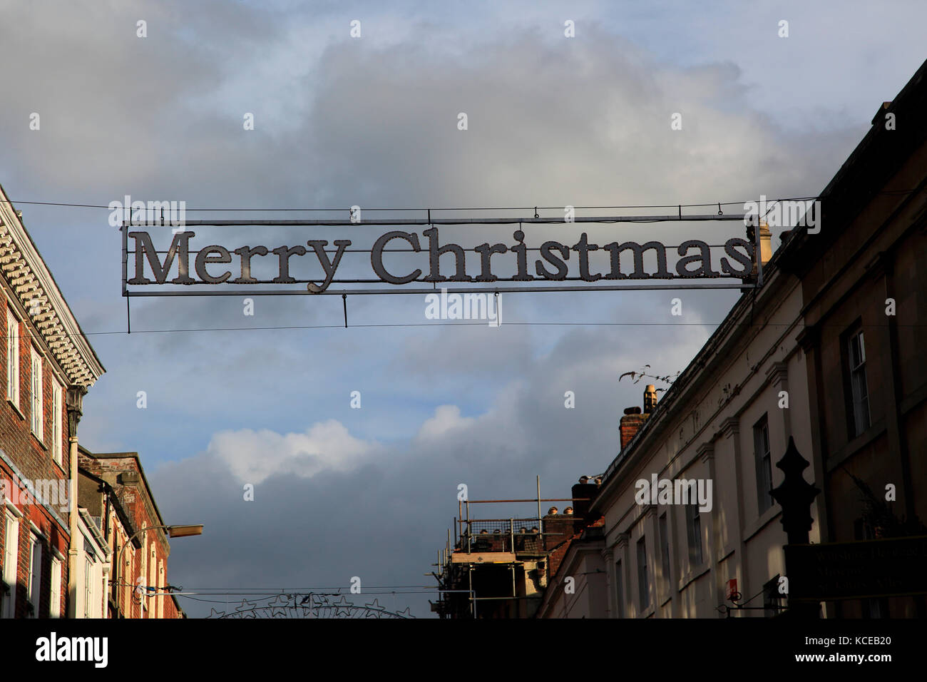 Merry Christmas banner sign between buildings, Devizes, Wiltshire ...