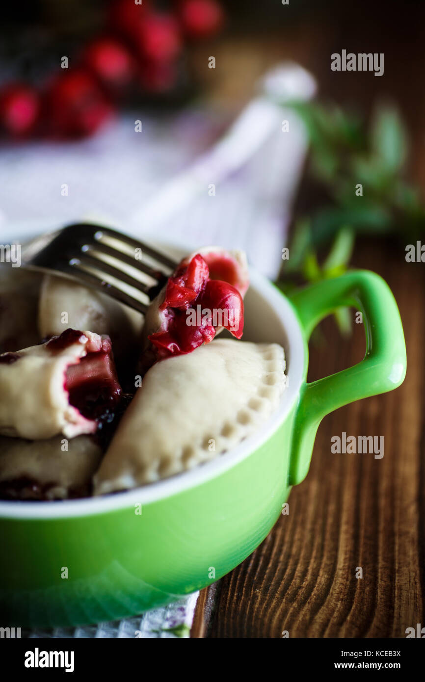 sweet dumplings with cherries in a bowl Stock Photo - Alamy