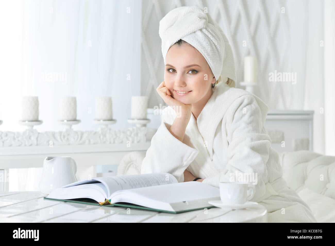Beautiful happy girl reading book Stock Photo - Alamy