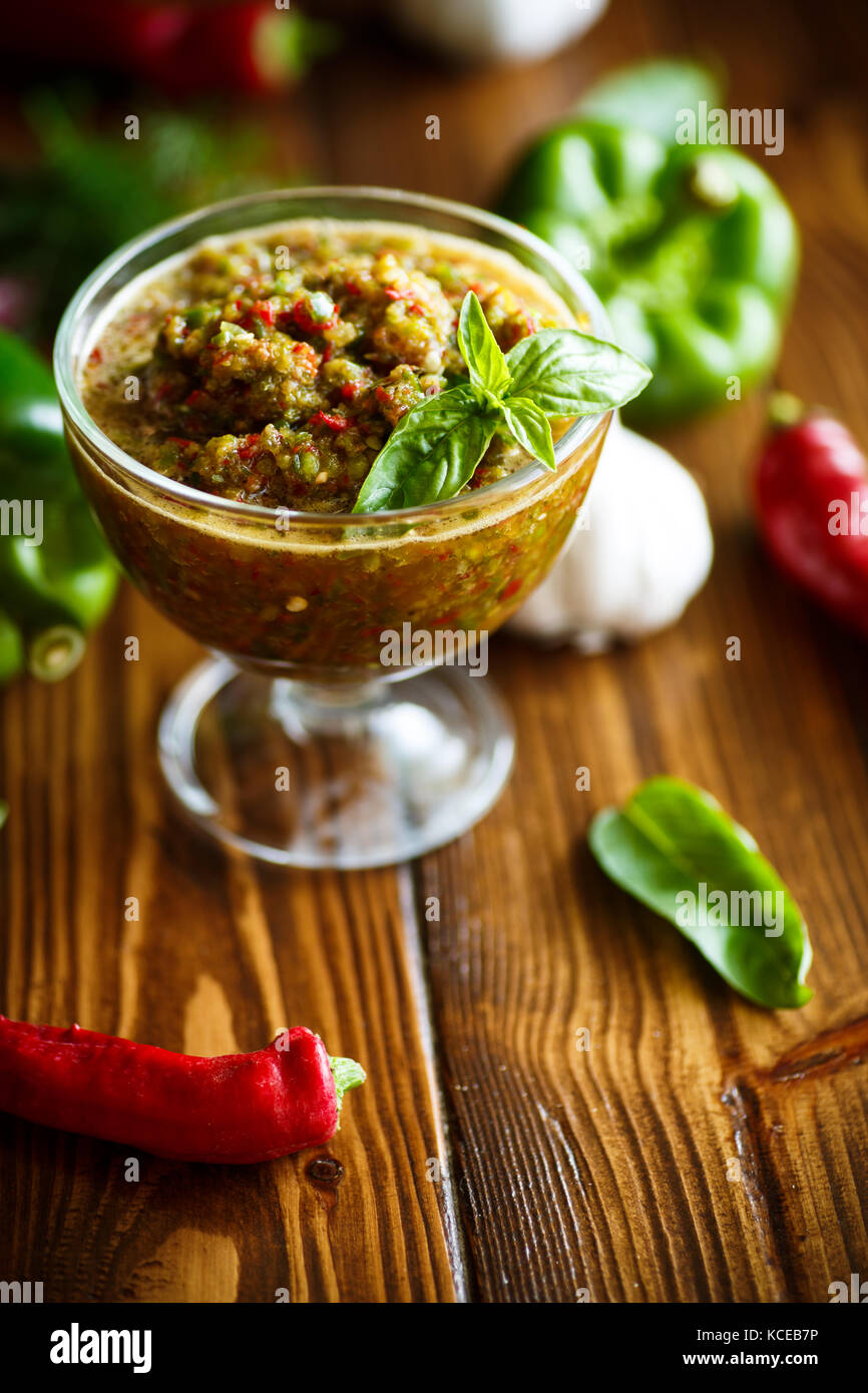 acute sauce of adzhika from various types of pepper Stock Photo - Alamy
