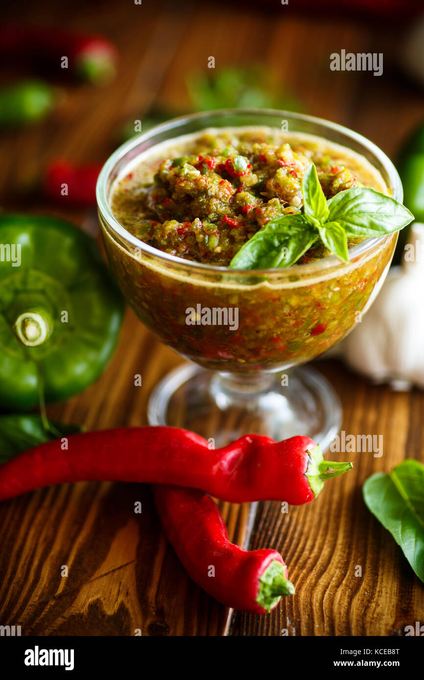 acute sauce of adzhika from various types of pepper Stock Photo - Alamy