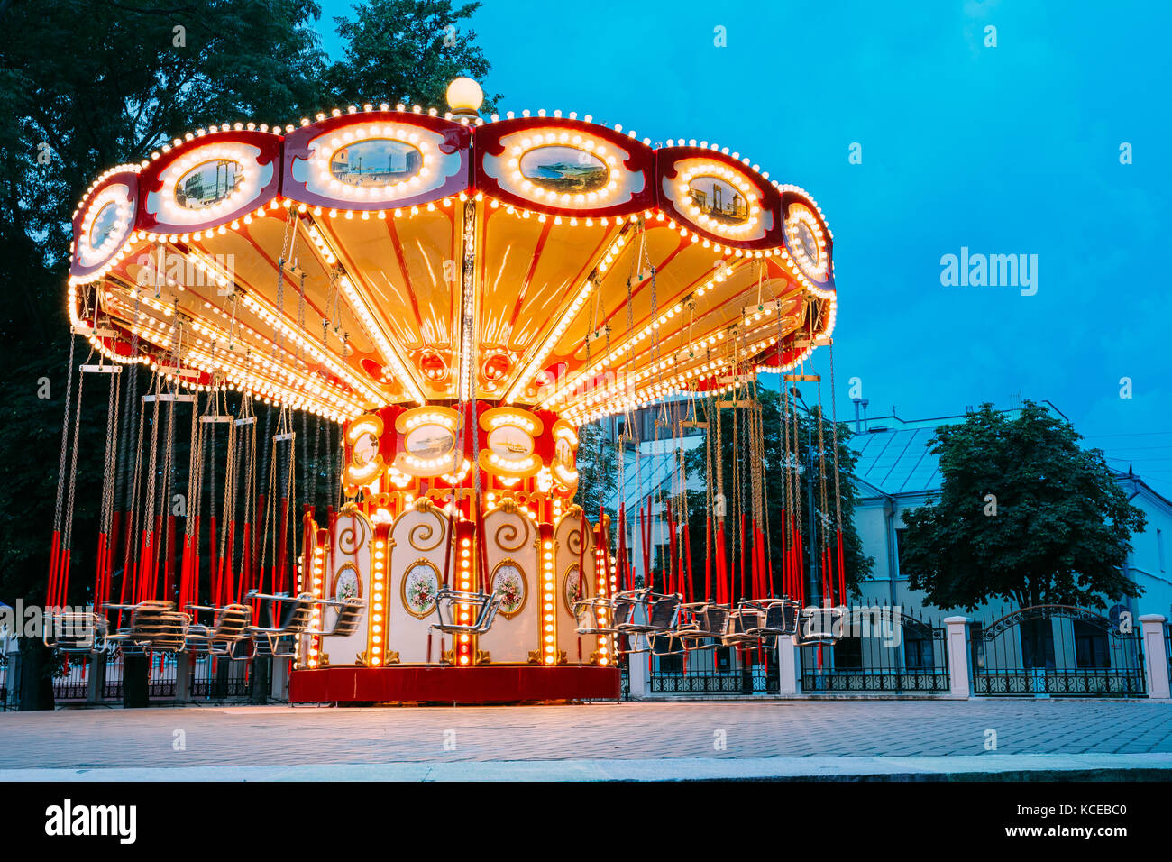 The Brightly Illuminated Empty Carousel Merry-Go-Round With Seats ...