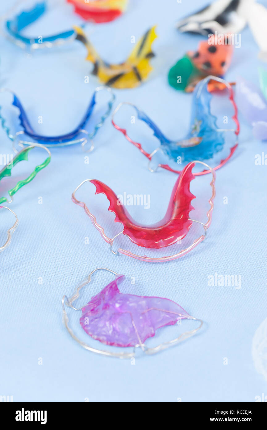 Dental braces or teeth retainers on table in dental clinic. Dental care ...