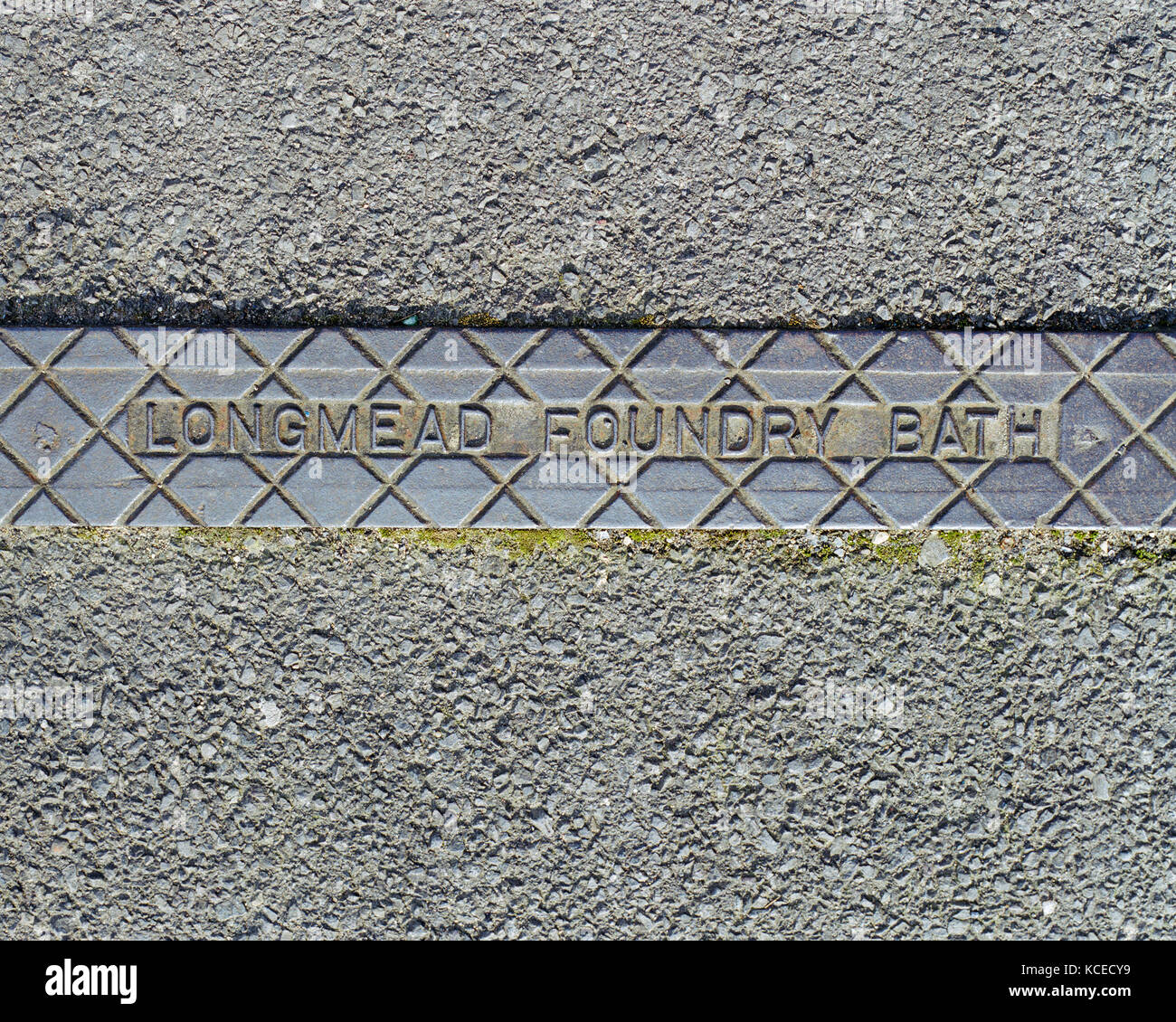Swindon, Wiltshire. A pavement rainwater gully cover plate made by ...