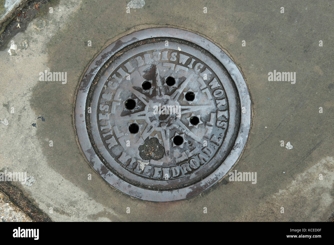 Arbour Square, Tower Hamlets, London. Coal hole plate outside number 48 ...