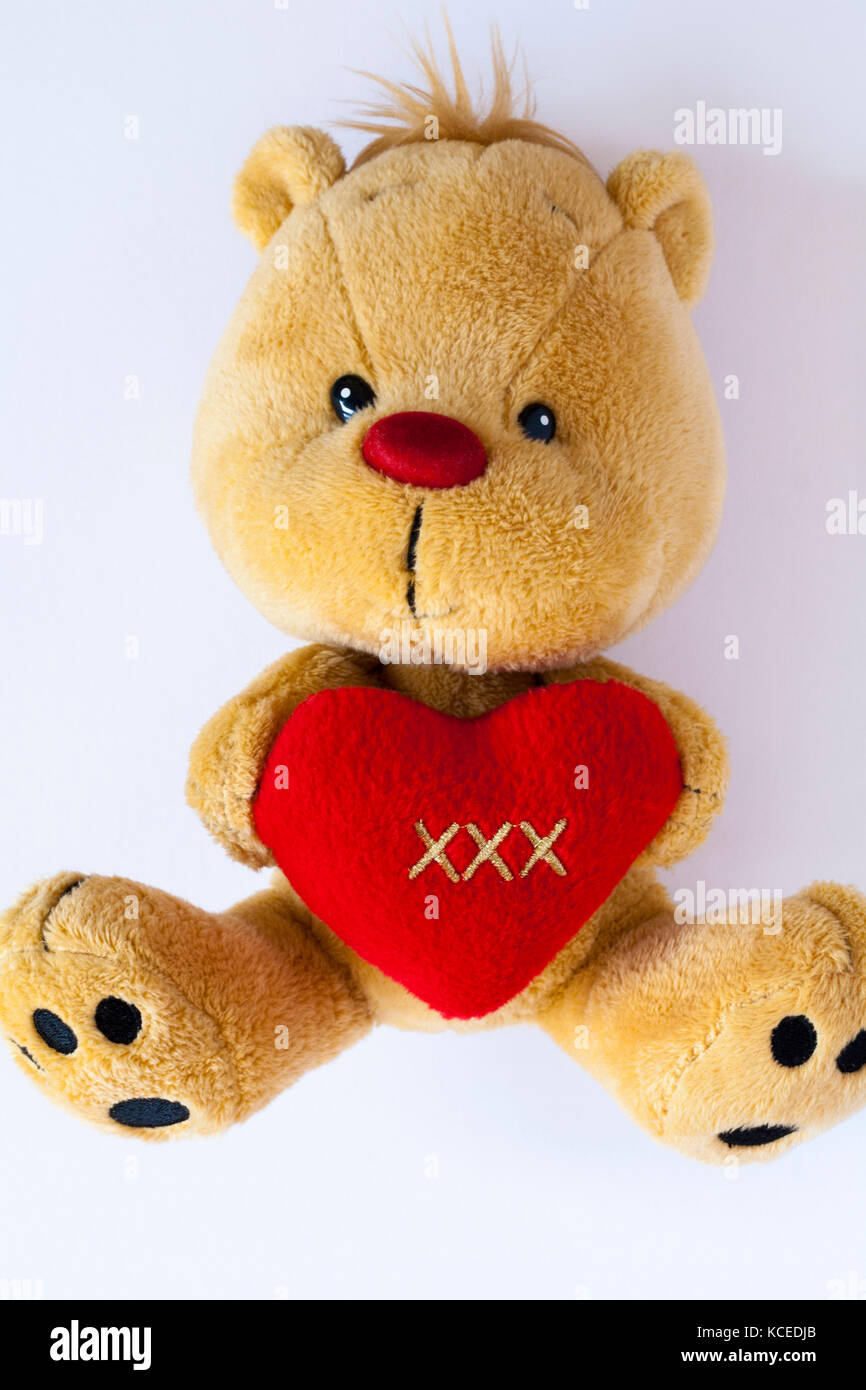 Teddy bear holding red heart with three x's soft cuddly toy set on ...