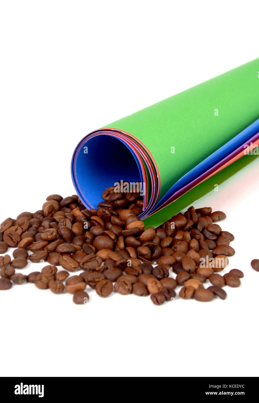 Coffee beans pouring out from color papers Stock Photo - Alamy