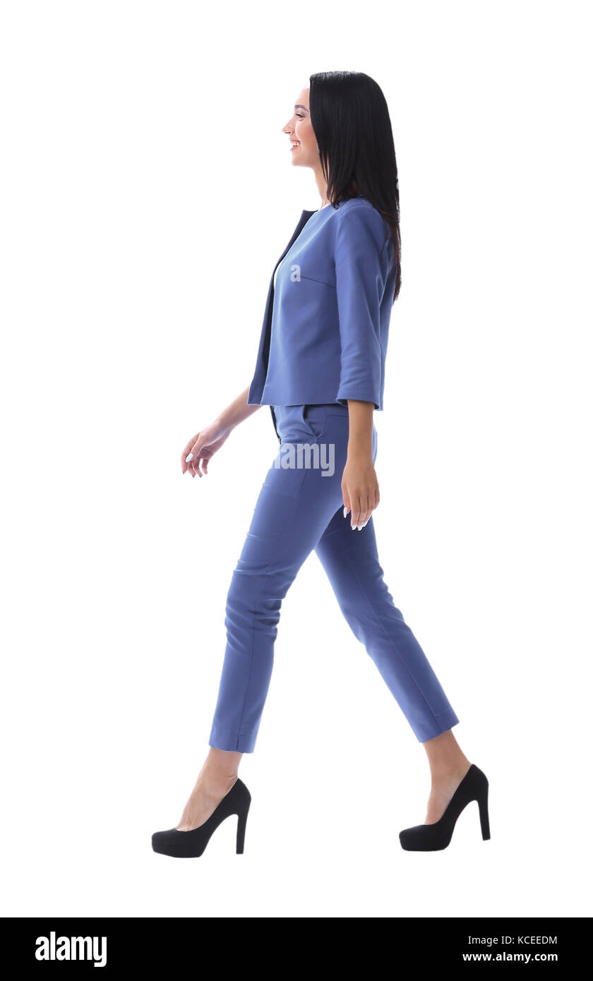 Beautiful young woman in blue suit. Side view Stock Photo - Alamy