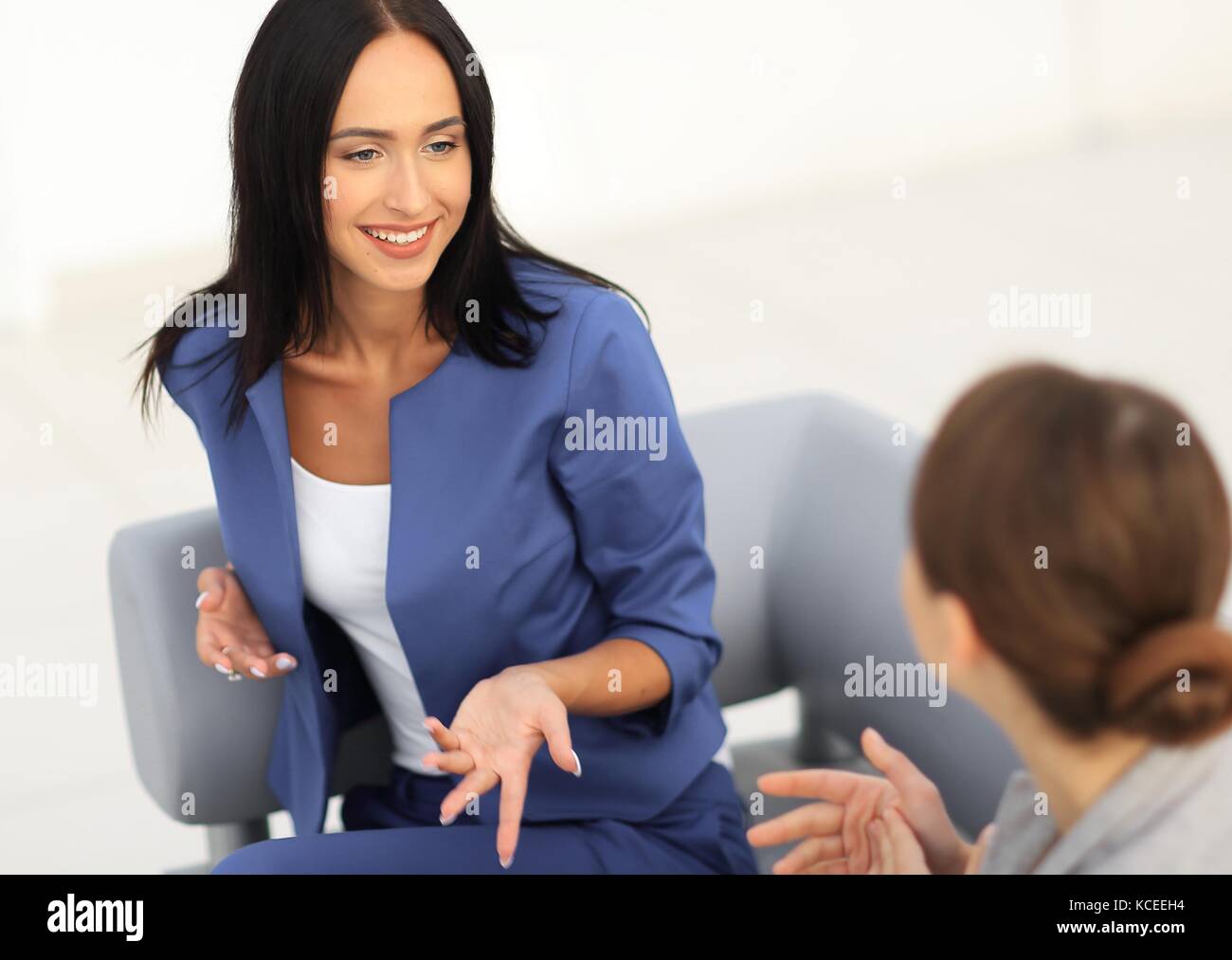 Portrait of good colleagues chatting with each other Stock Photo - Alamy