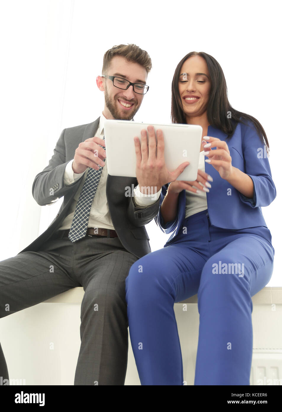 Portrait of a business executive holding a digital tablet in the office ...