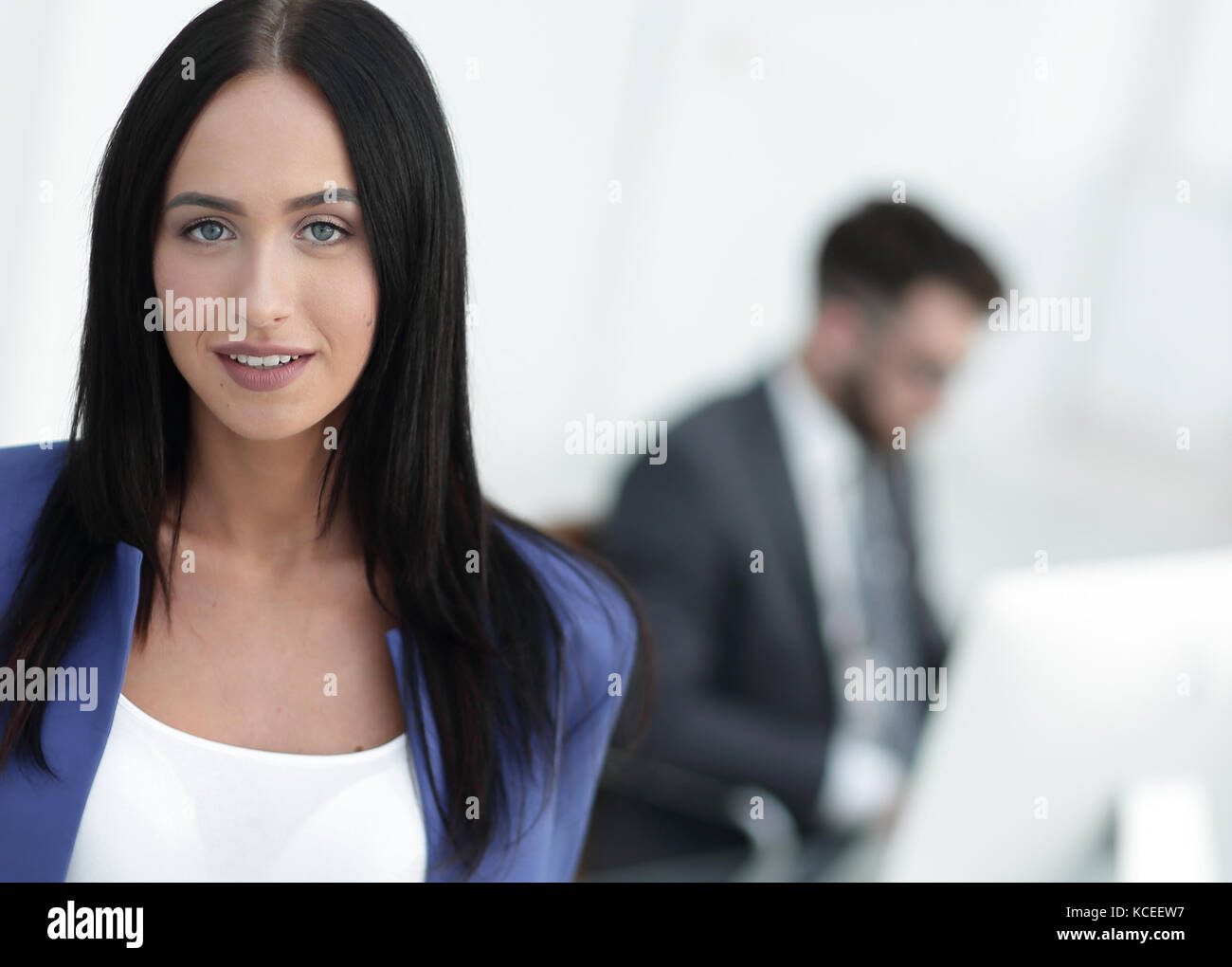 Face of beautiful woman on background of partner in office Stock Photo ...
